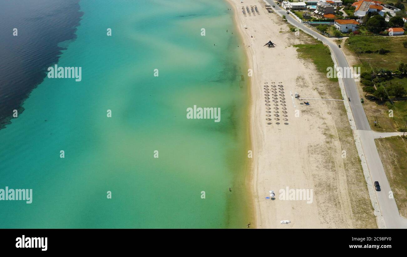Aerial view of a blue ocean near a cliffy shore at daytime Stock Photo ...