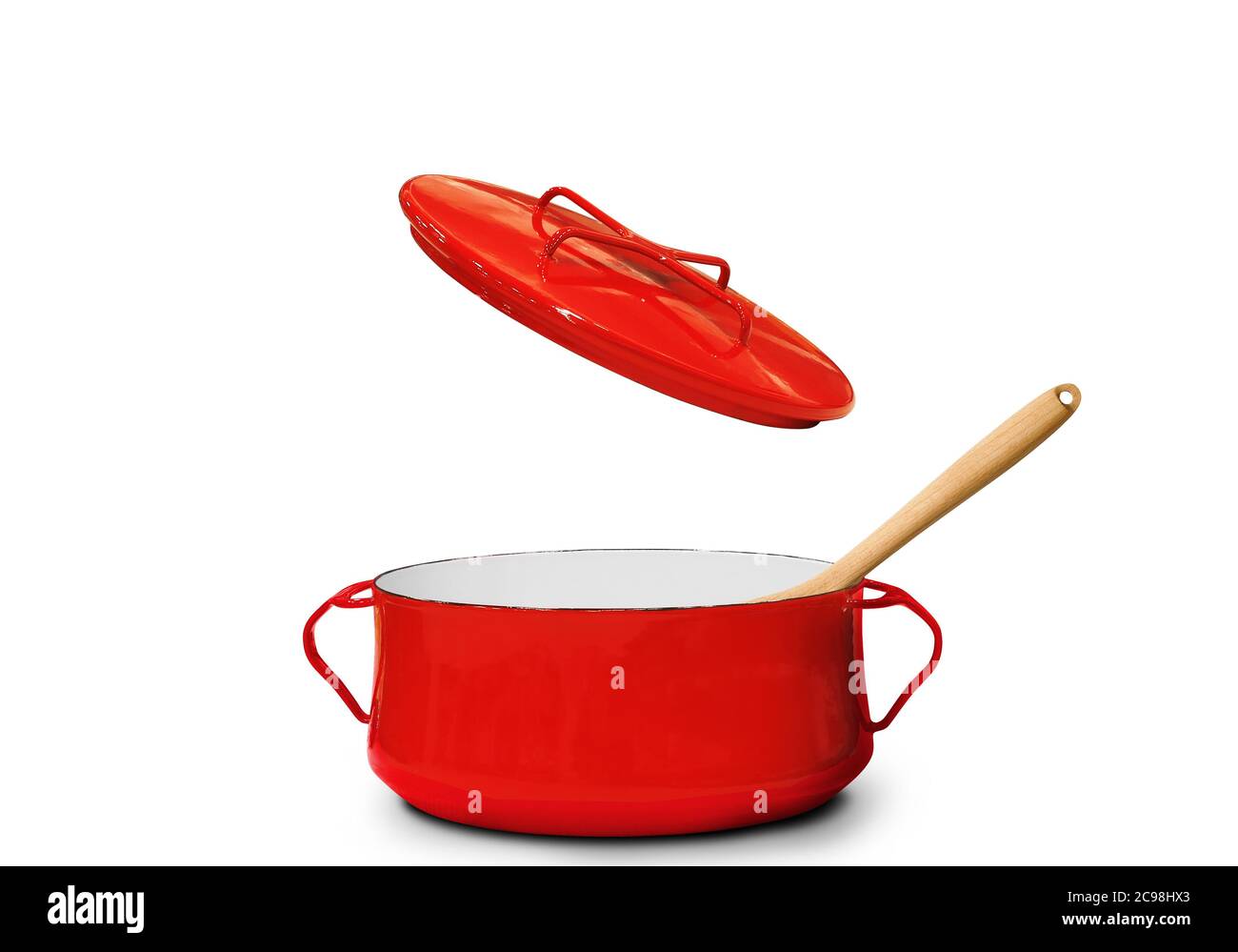 Big red pot for soup with fork and spoon Stock Photo - Alamy