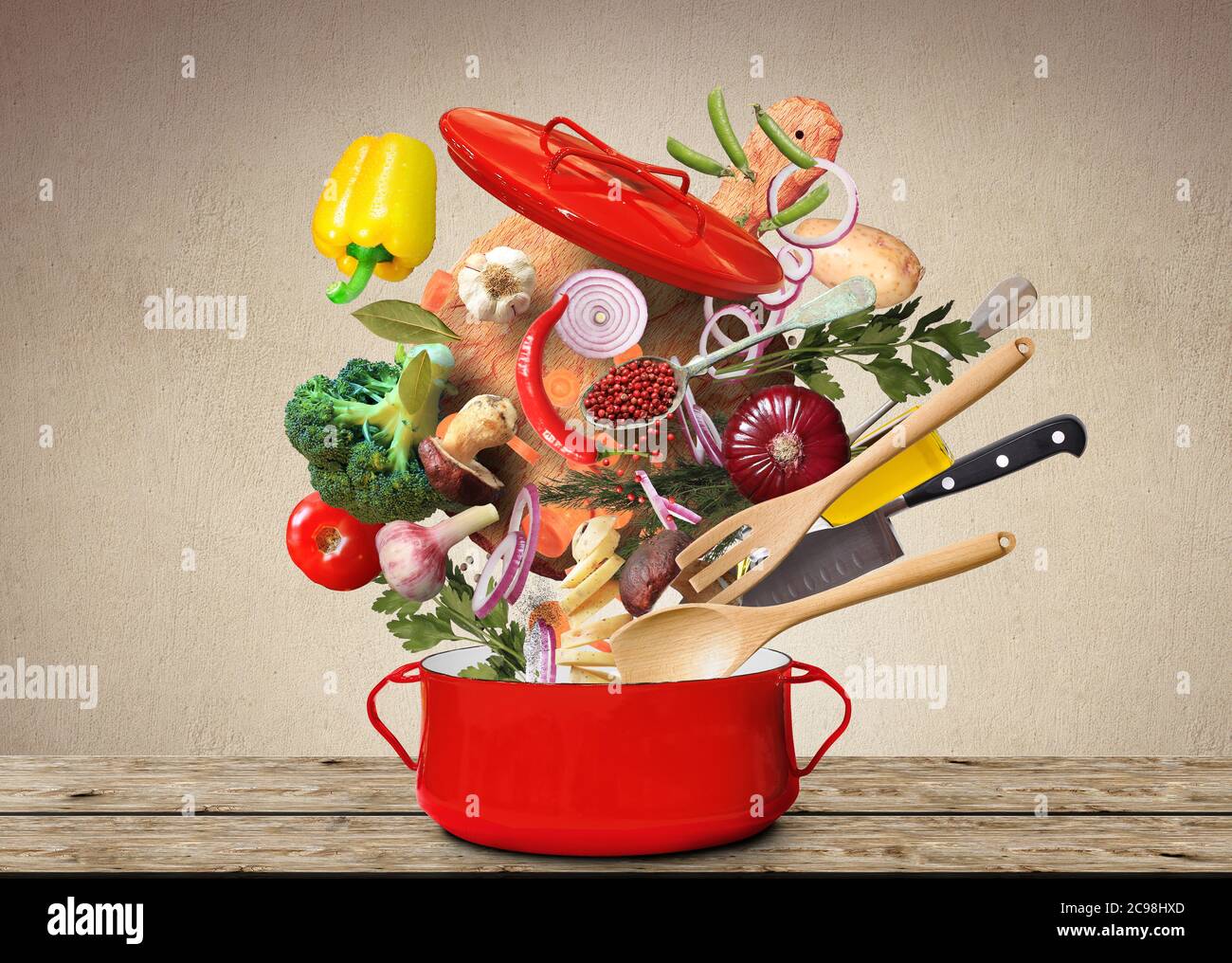 Big red pot with meat and vegetables Stock Photo - Alamy