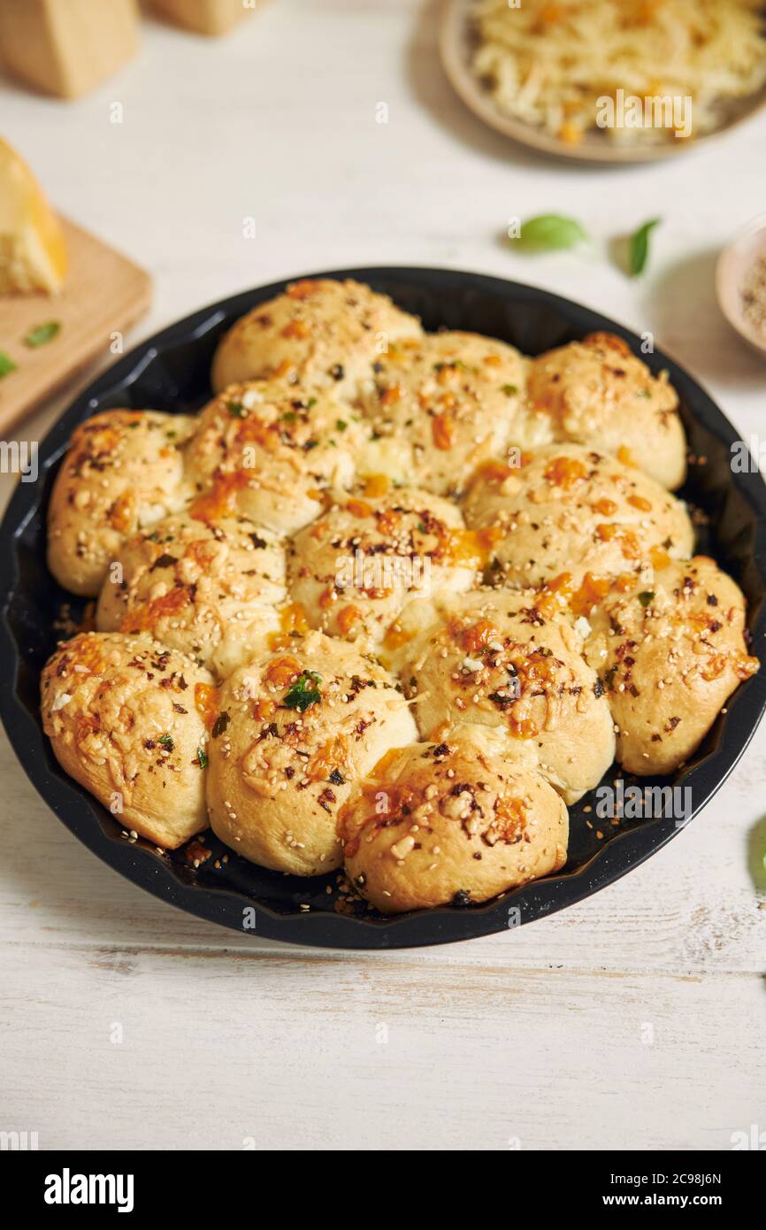Freshly-made delicious cheese bubble pizza bread with ingredients and ...