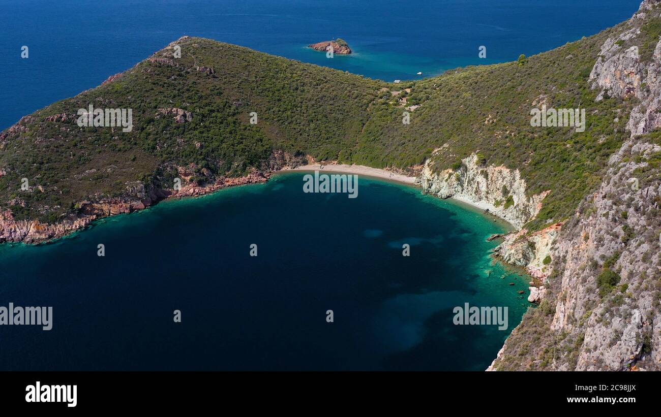 Aerial view of a blue ocean near a cliffy shore at daytime Stock Photo ...