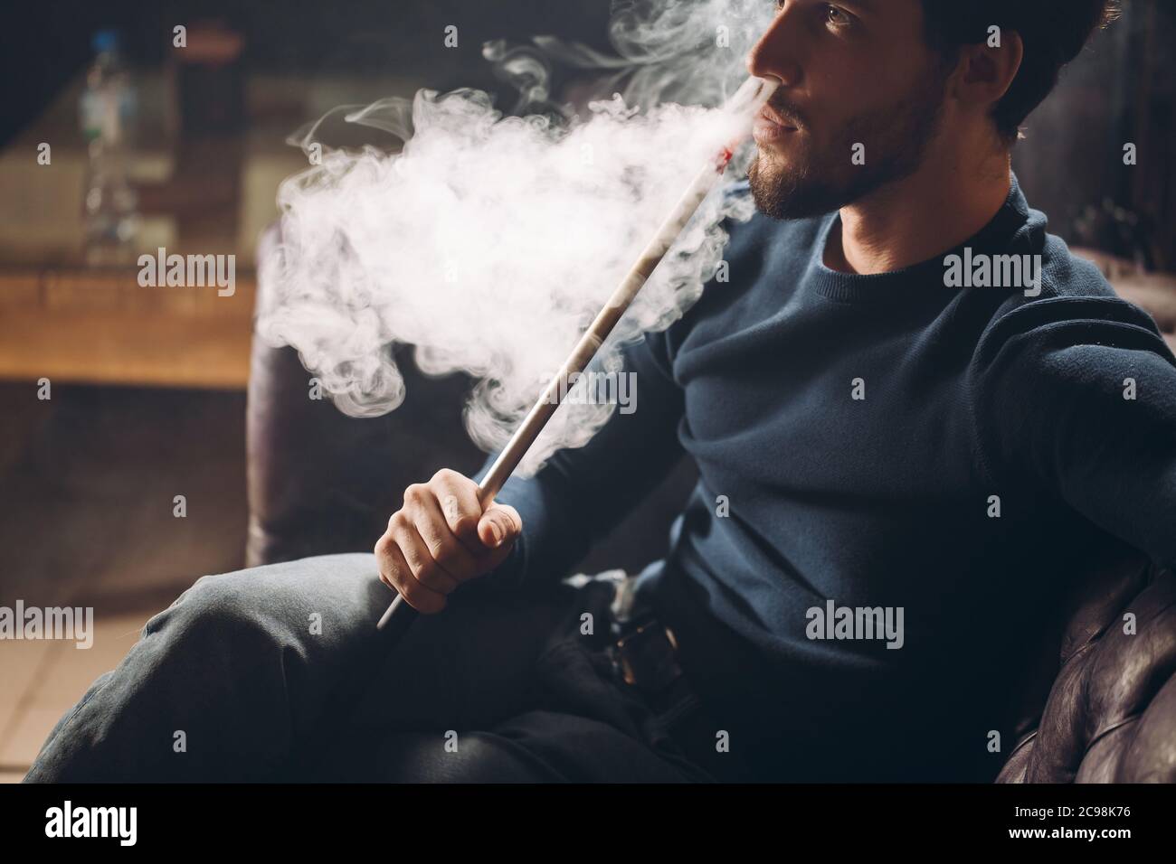 young cool guy enjoying luxury life. close up cropped side view photo ...