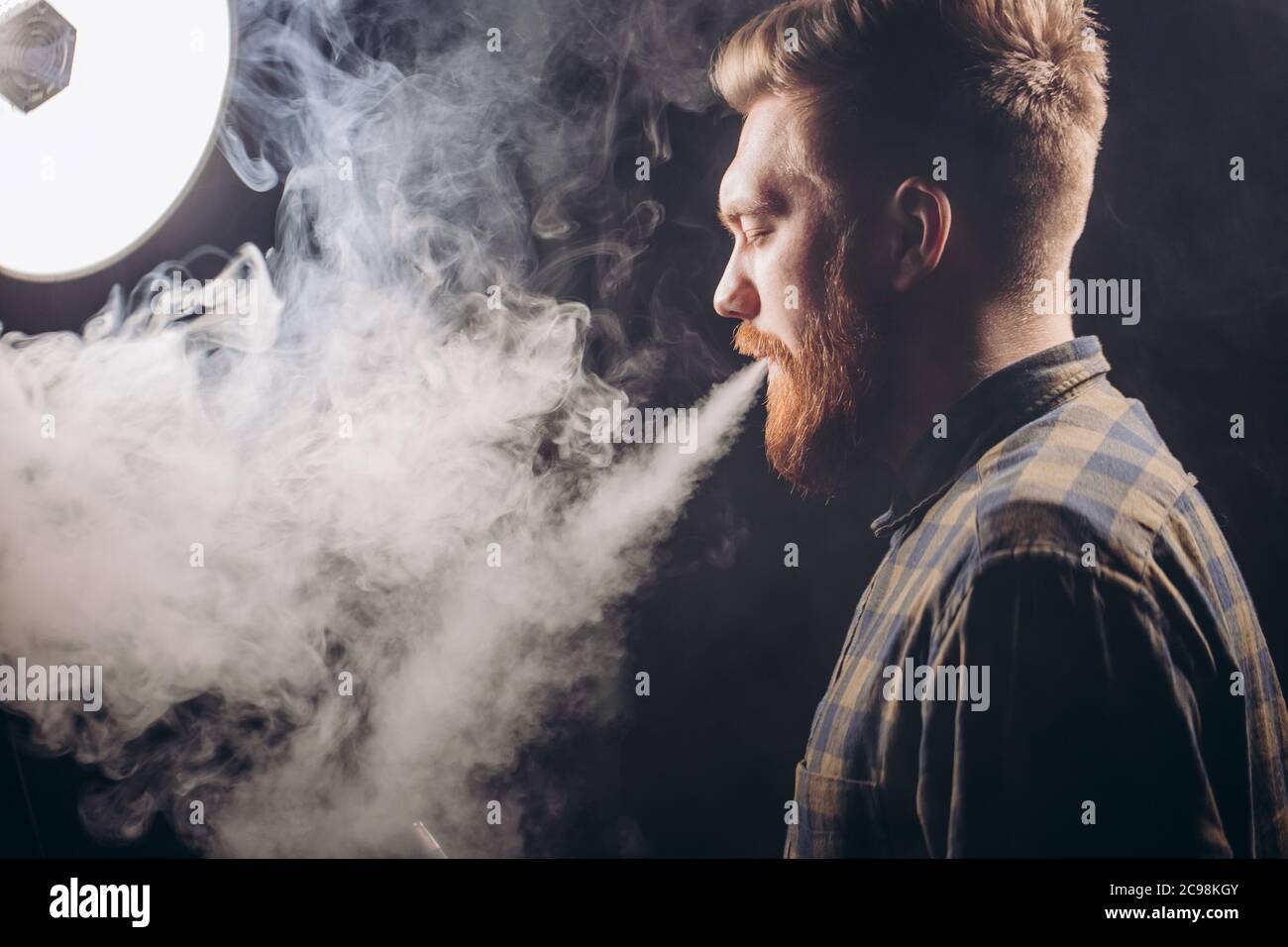 ginger emotional man reducing stress. red-haired mna smoking drugs on ...