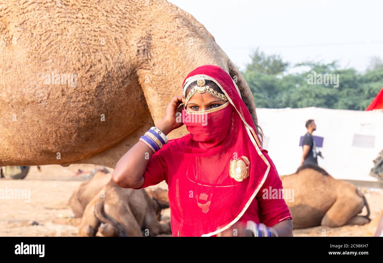 A portrait of Young Indian woman in ethnic dress and jewellery at ...