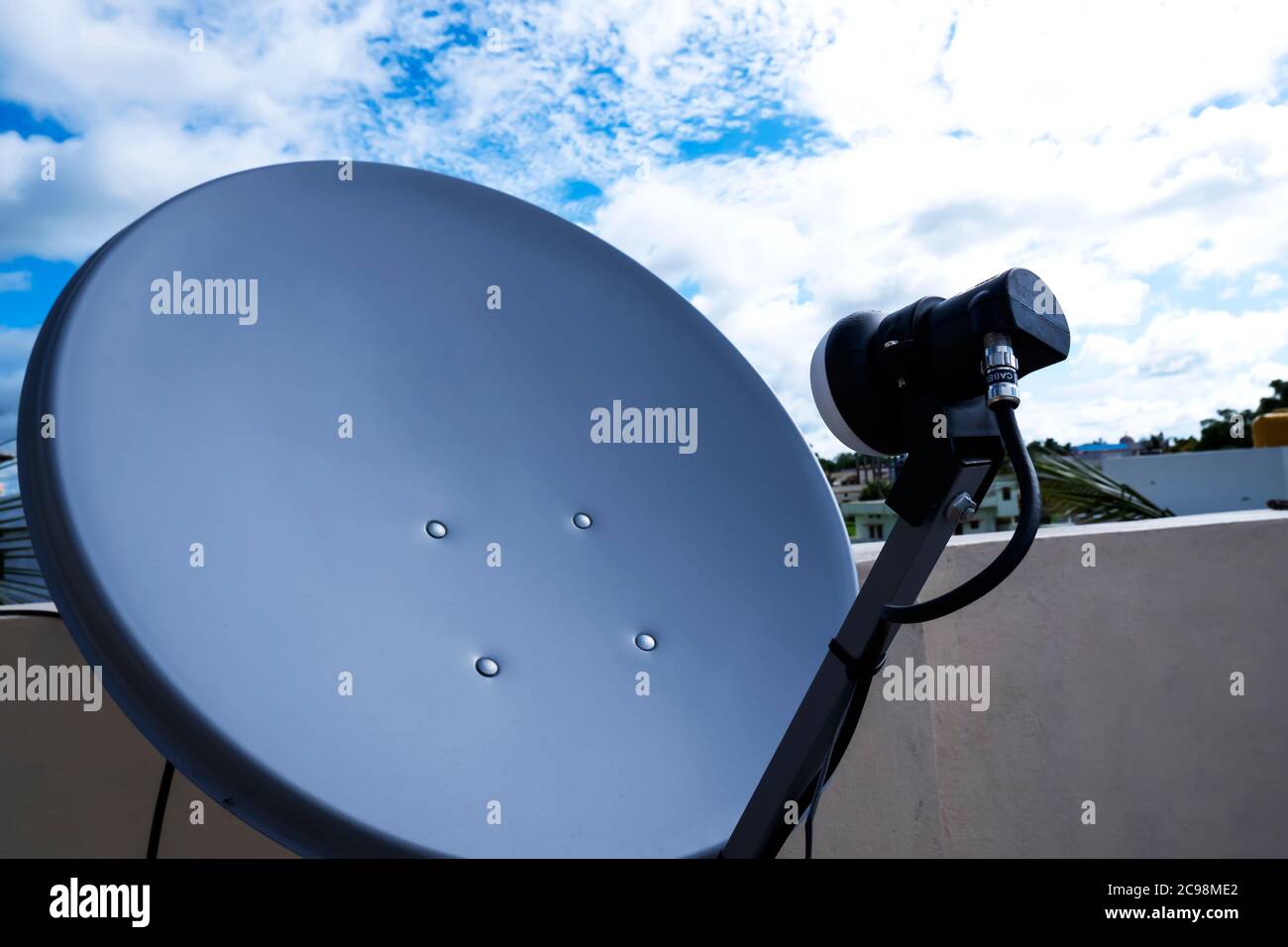 a close view of digital satellite dish antenna on building Stock Photo ...