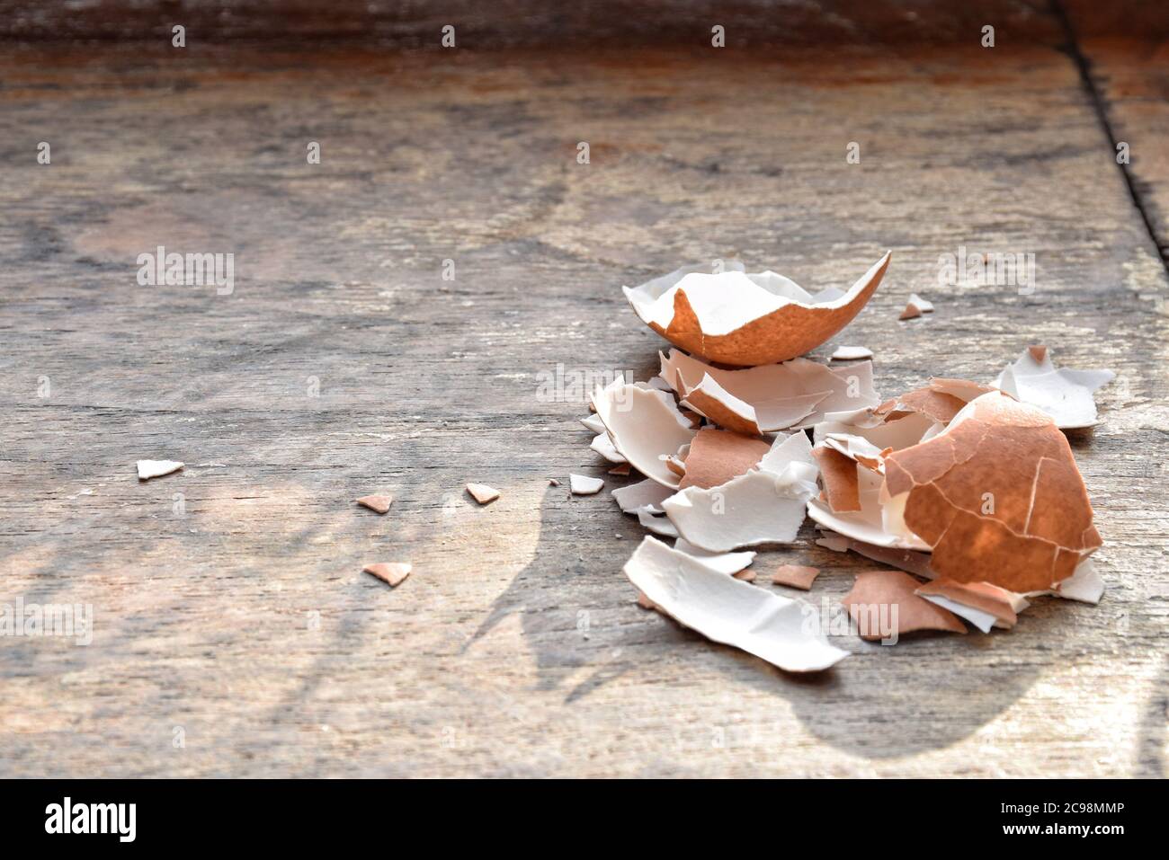 Egg shell on Wooden table with copy space Stock Photo - Alamy