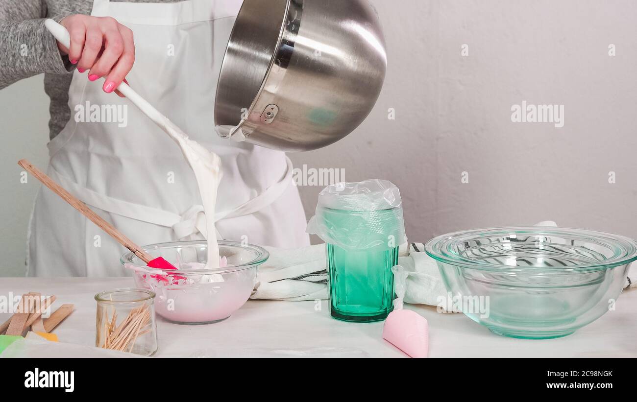 Step by step. Flat lay. Mixing royal icing in electric kitchen mixer ...