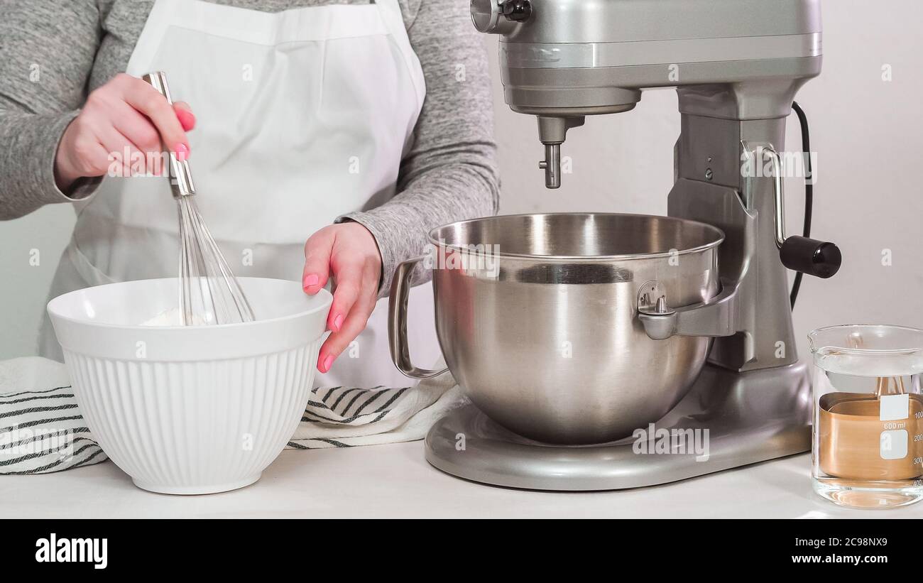Step by step. Flat lay. Mixing royal icing in electric kitchen mixer ...