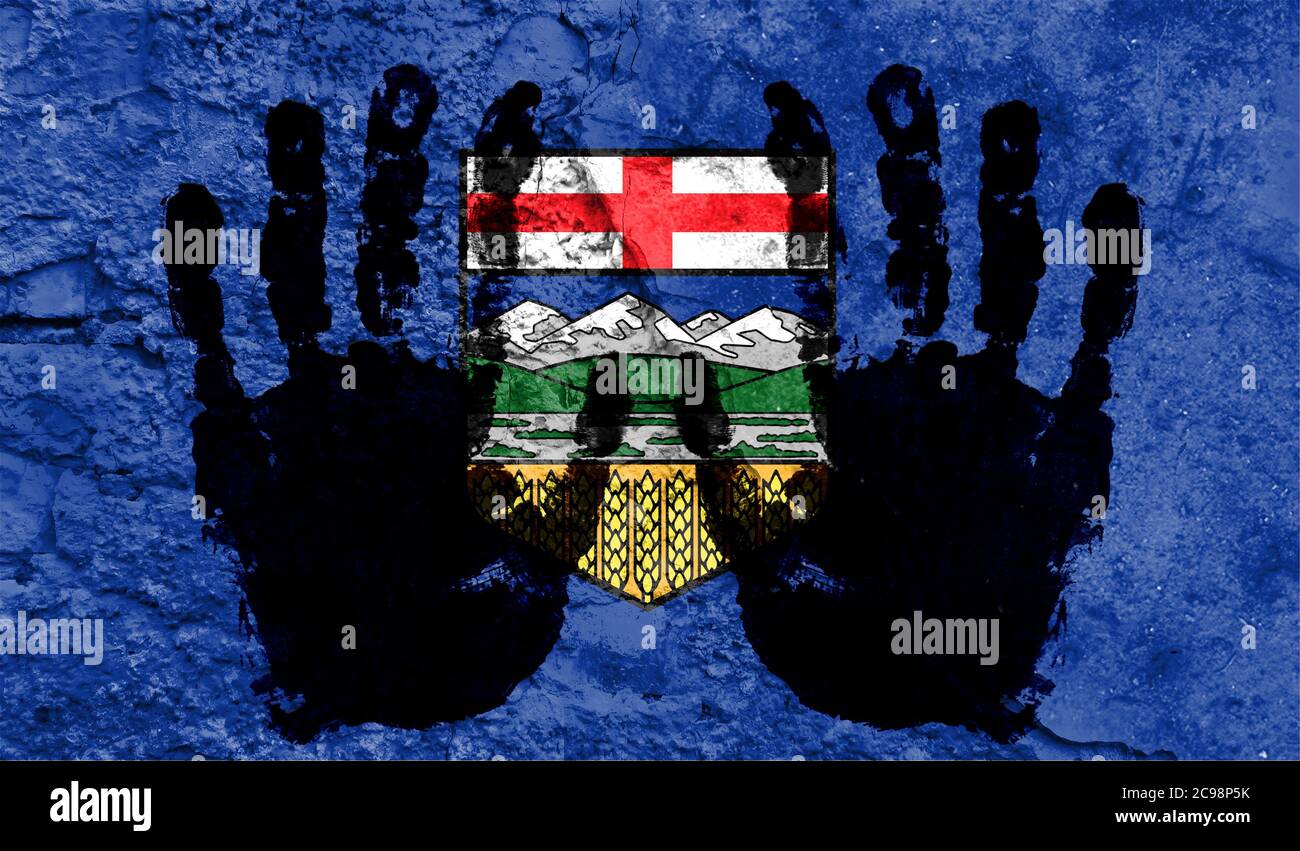 Handprints on the background of the flag of Alberta. Freedom of choice ...