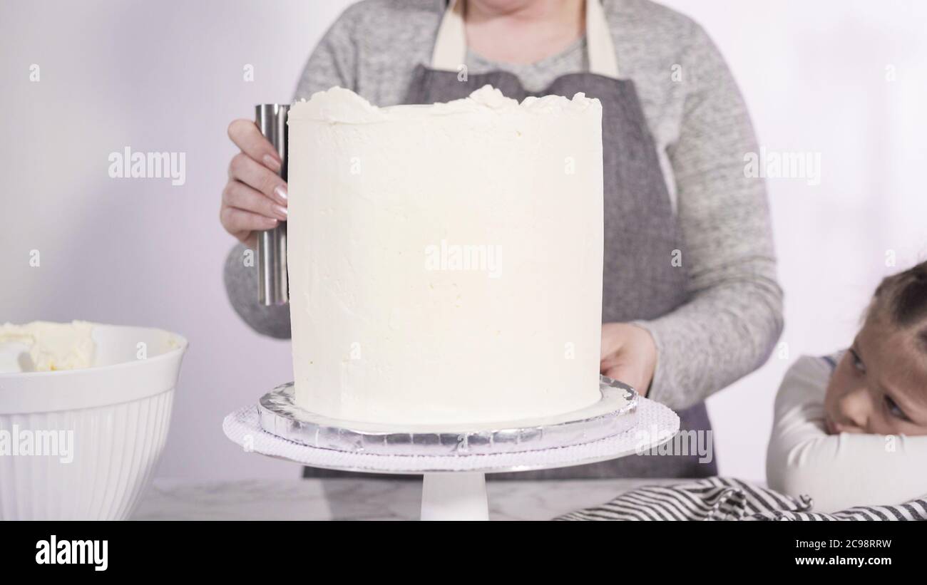 Step by step. Frosting round funfetti cake with white italian ...