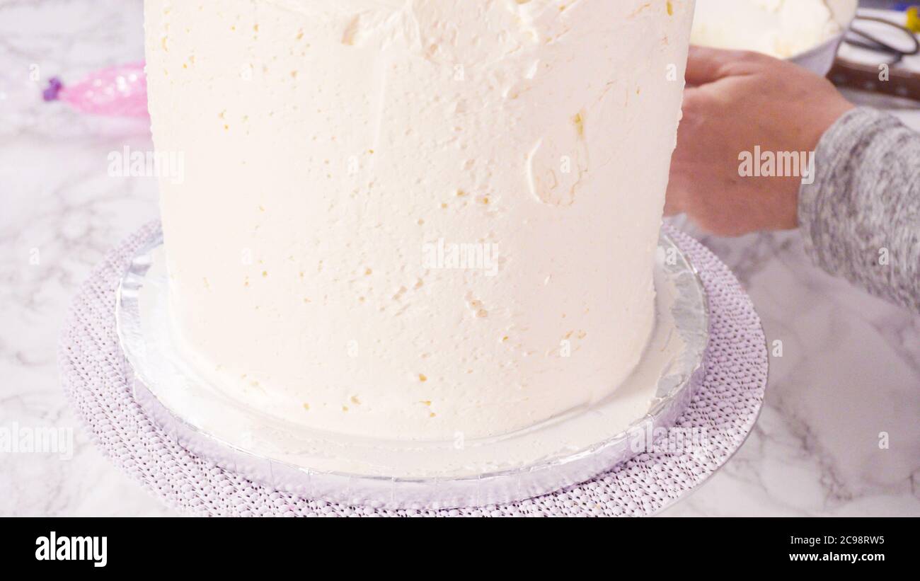 Step by step. Frosting round funfetti cake with white italian ...