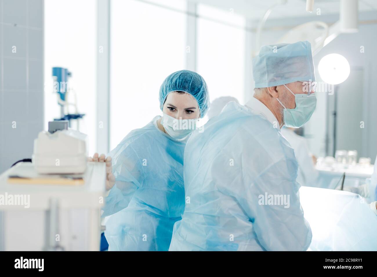beautiful nurse checking all the parameters of equipment. woman ...