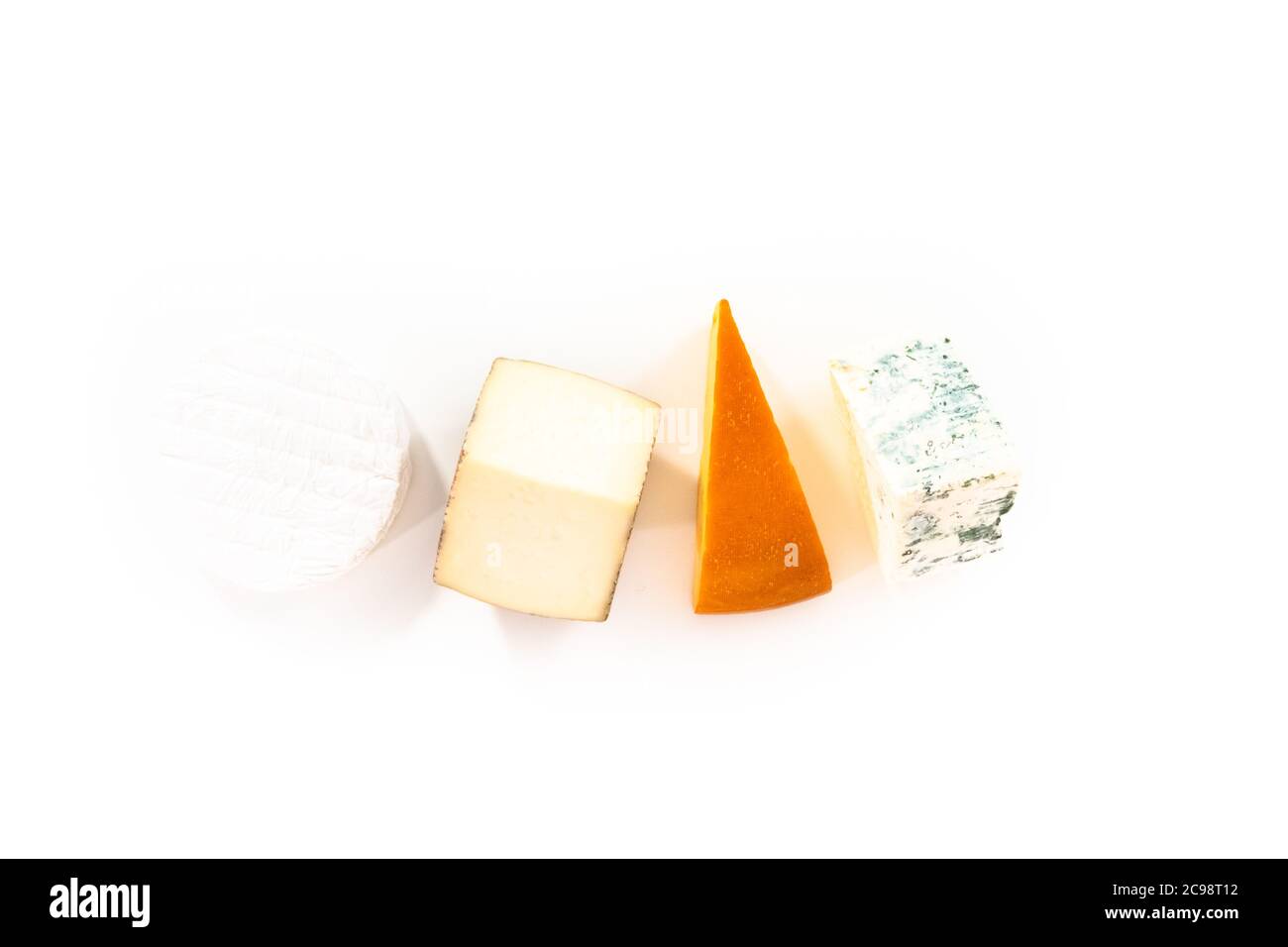Variety of large wedges gourmet cheese on a white background Stock ...