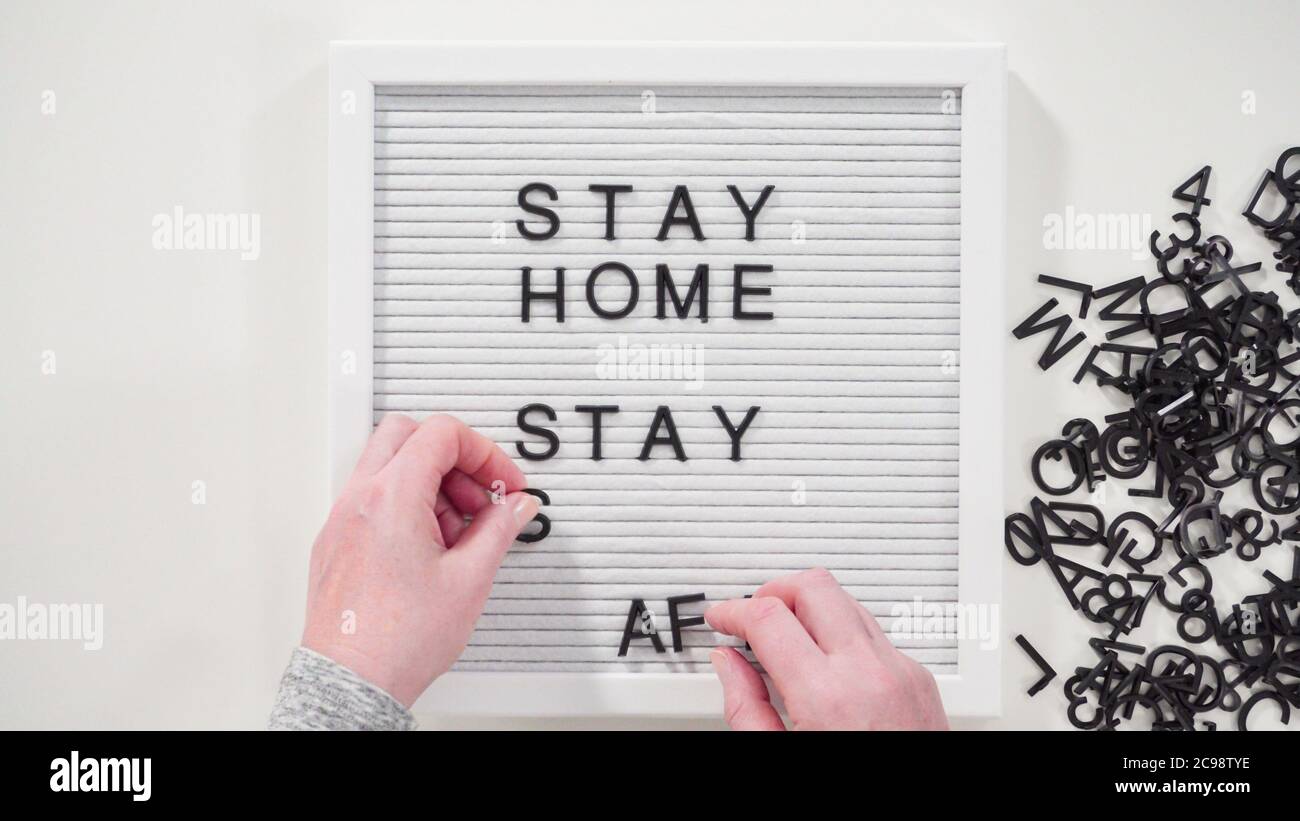Flat lay. STAY HOME and STAY SAFE sign on a white message board Stock ...