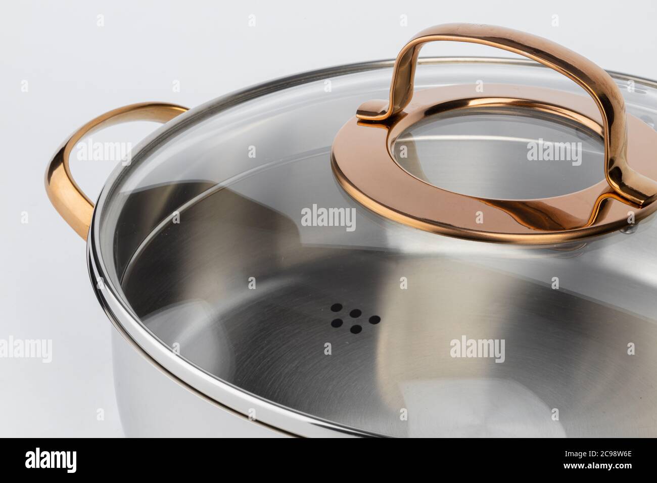 Glass cover of a new metal casserole Stock Photo - Alamy