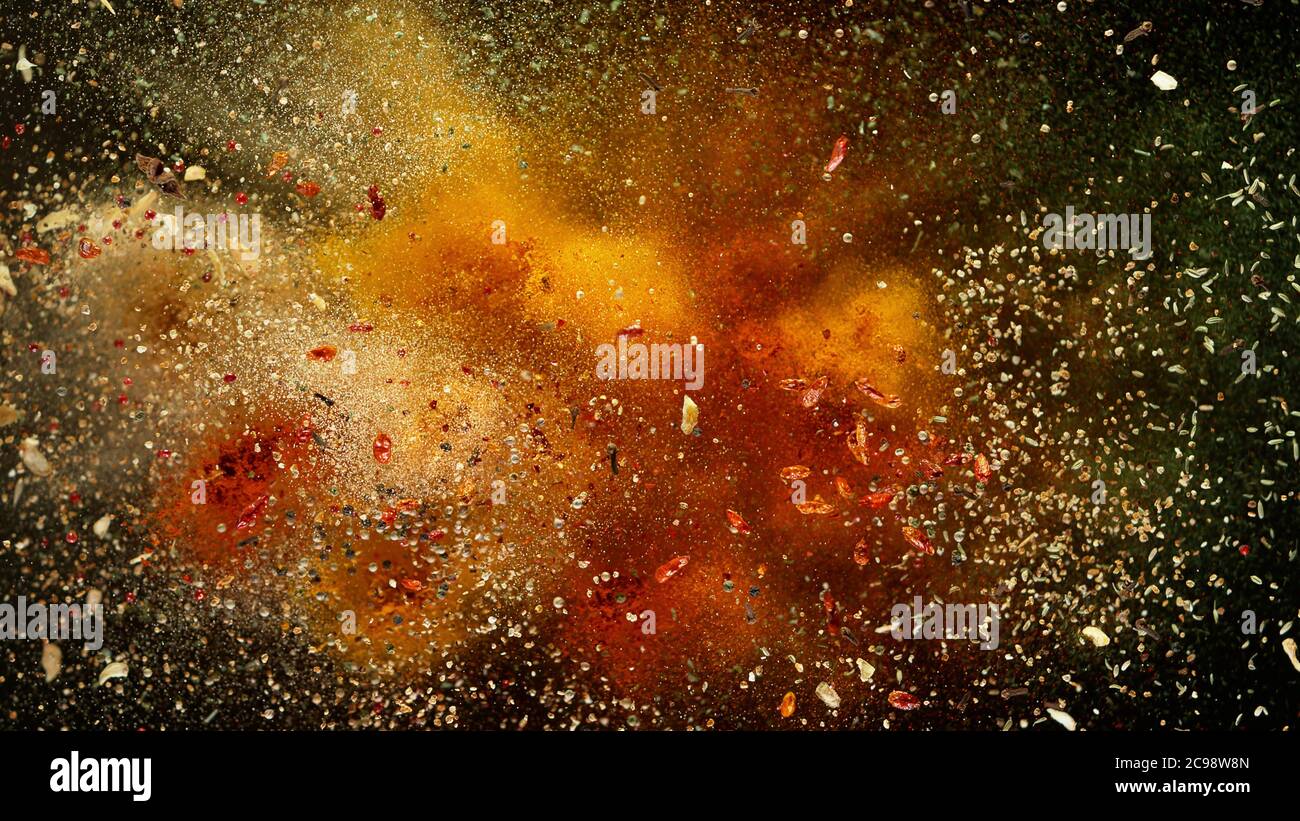 Freeze motion of various spice explosion, abstract culinary background ...