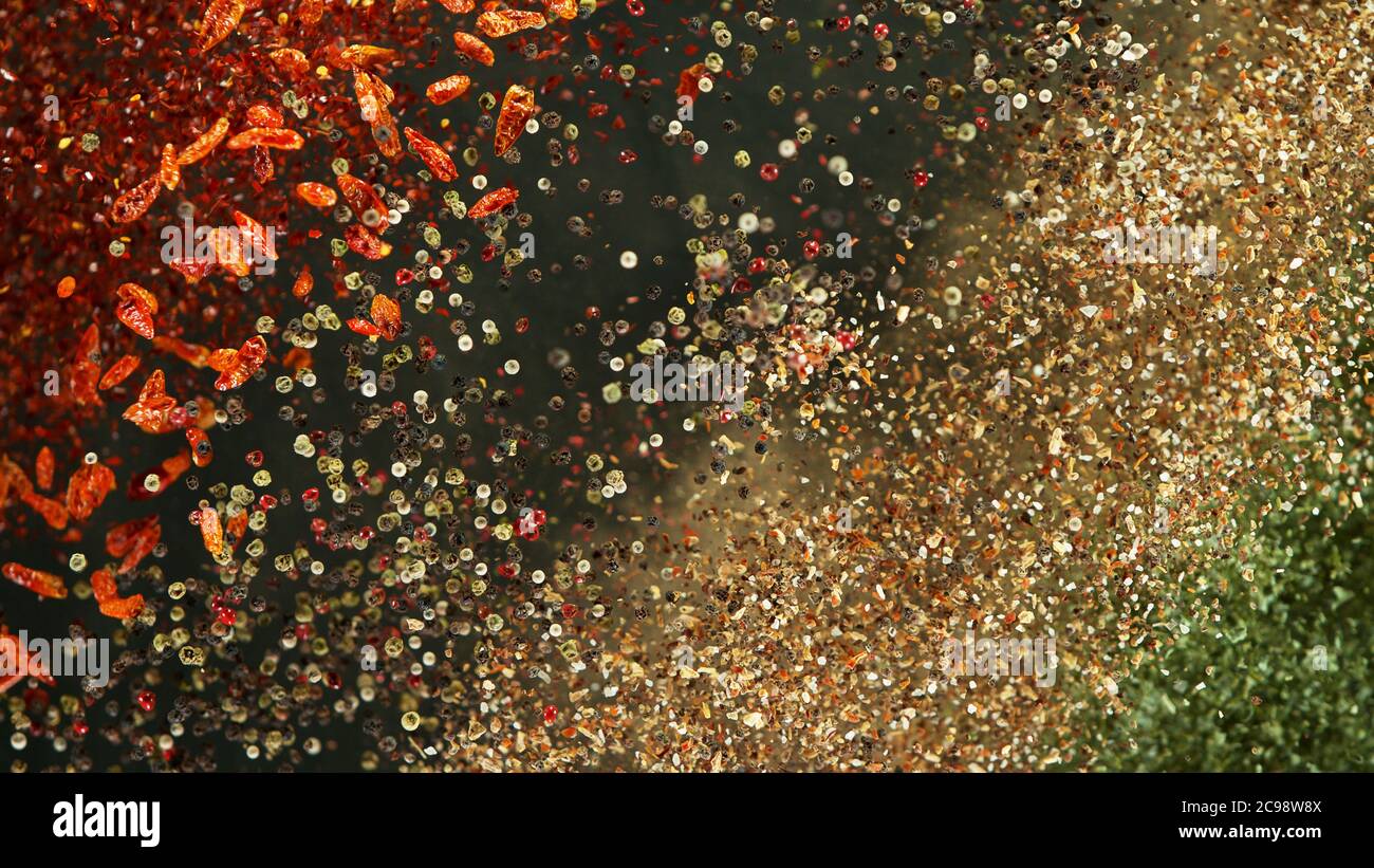 Freeze motion of various spice explosion, abstract culinary background ...