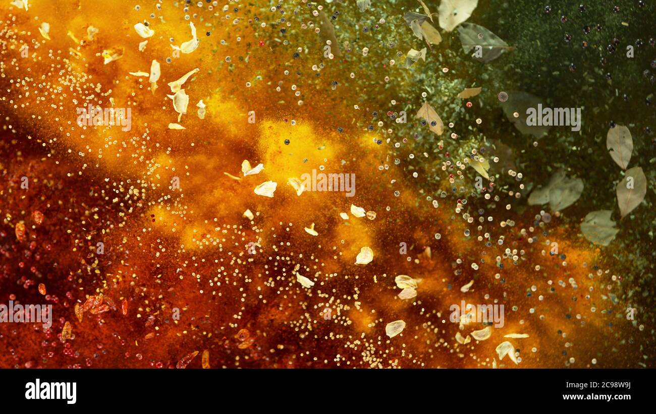 Freeze motion of various spice explosion, abstract culinary background ...