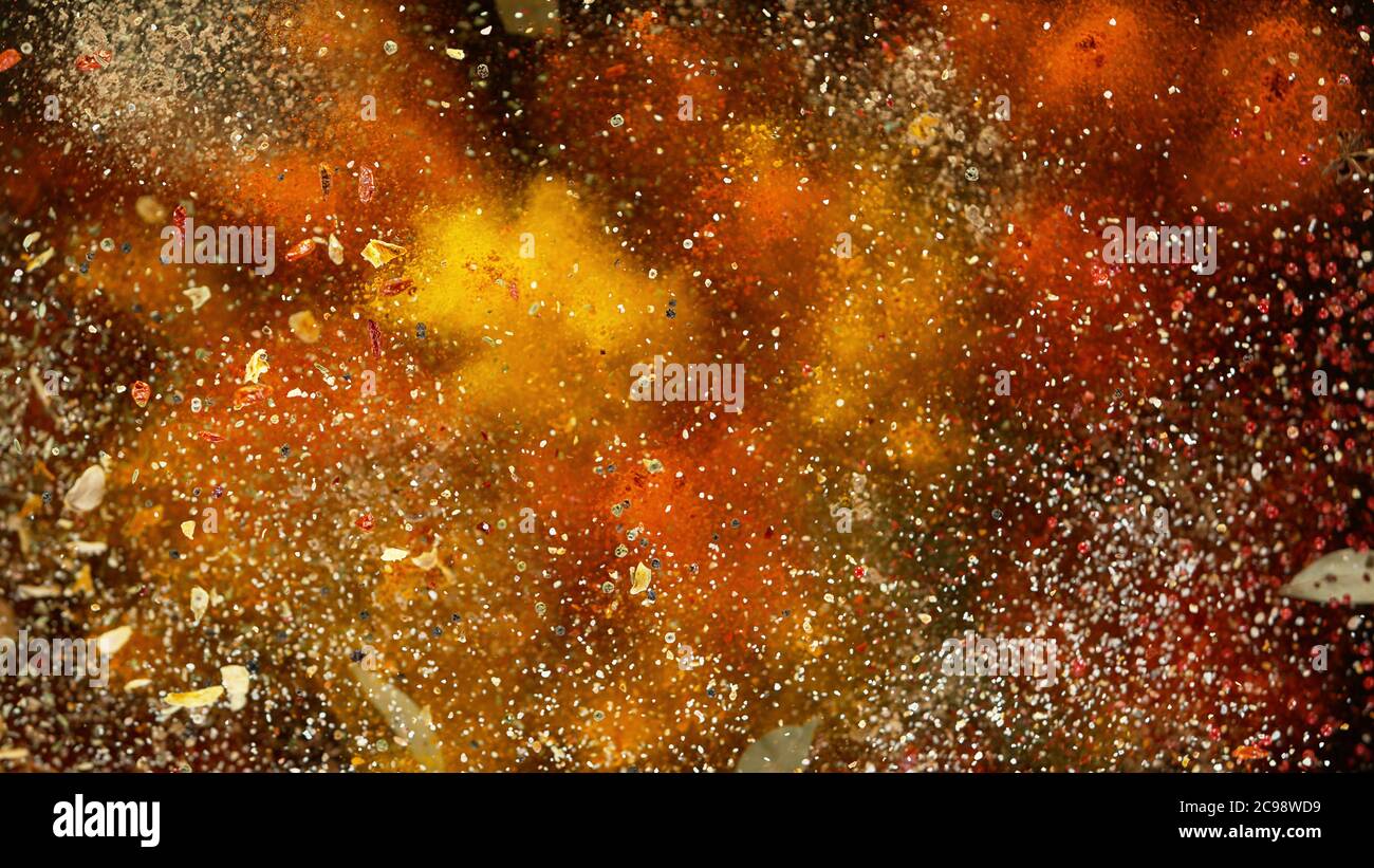 Freeze motion of various spice explosion, abstract culinary background ...