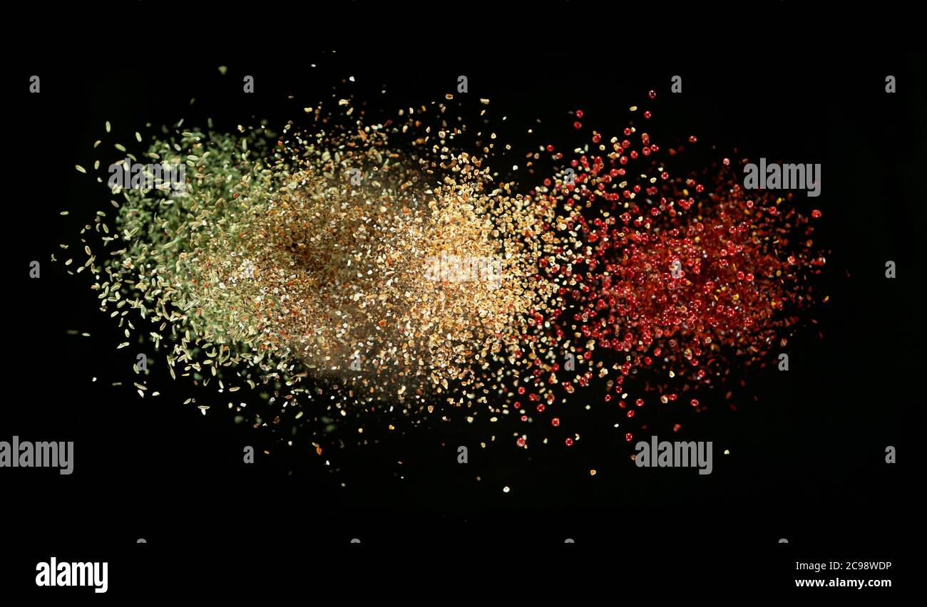 Freeze motion of various spice explosion, abstract culinary background ...