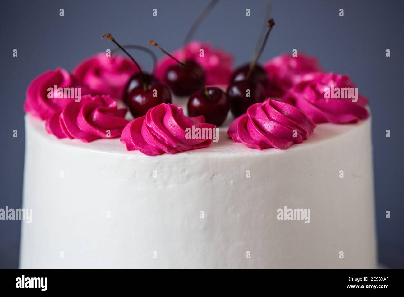 White Cream Icing Cake with Fruits Stock Photo - Alamy