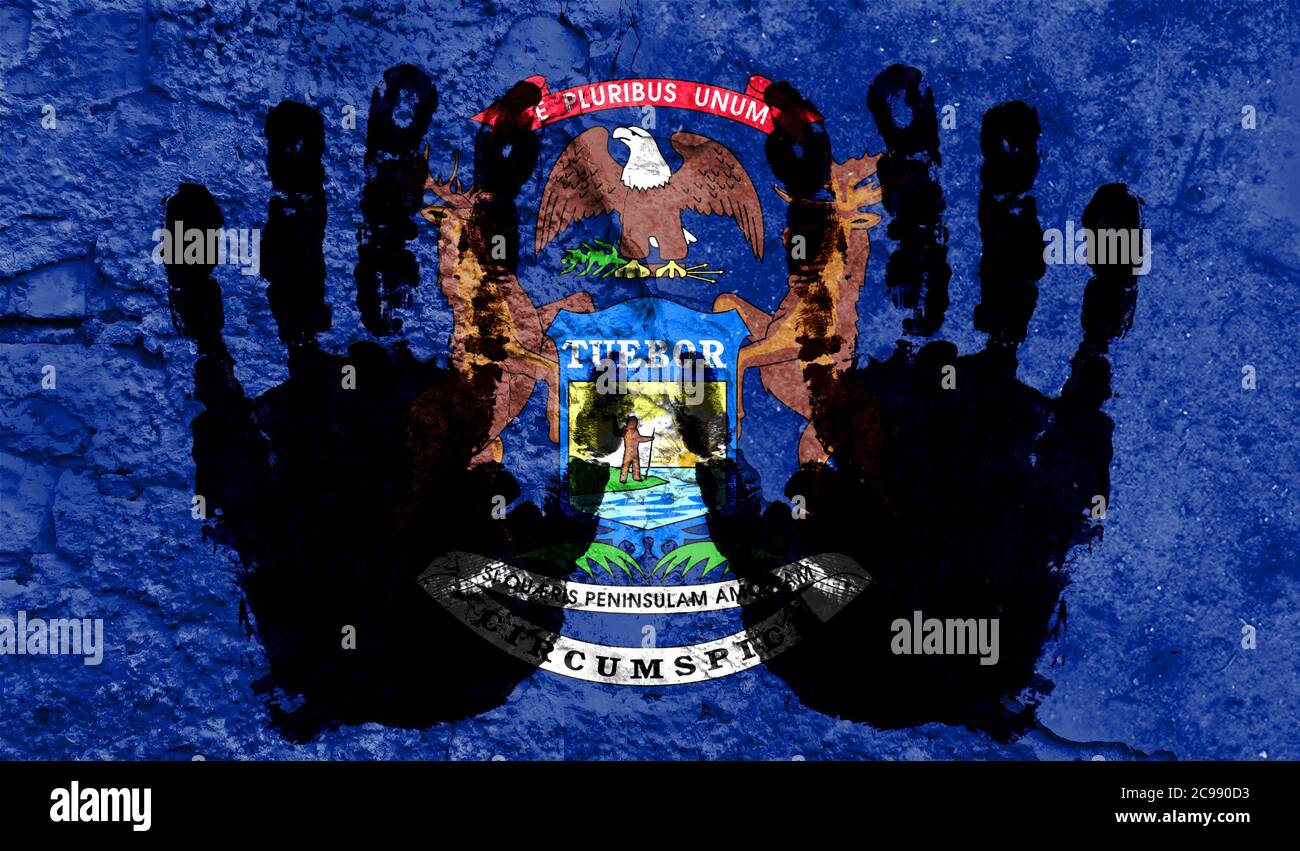 Handprints on the background of the flag of State of Michigan. Freedom ...