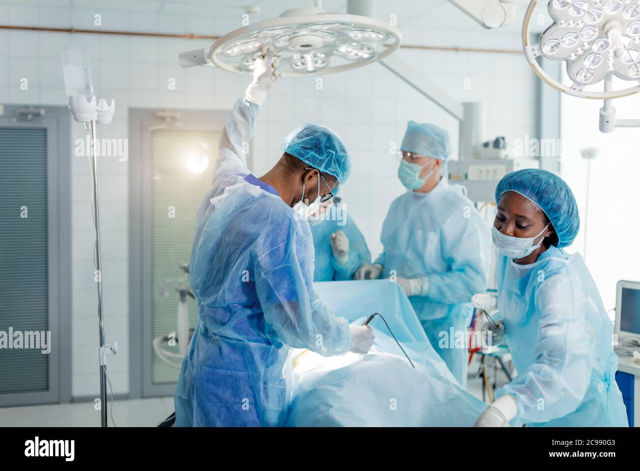 modern surgical practice. team members taking part in difficult ...