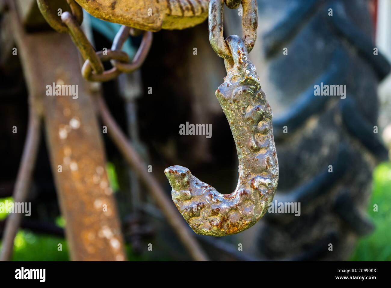 Rust hook as the detail of tractor Stock Photo - Alamy