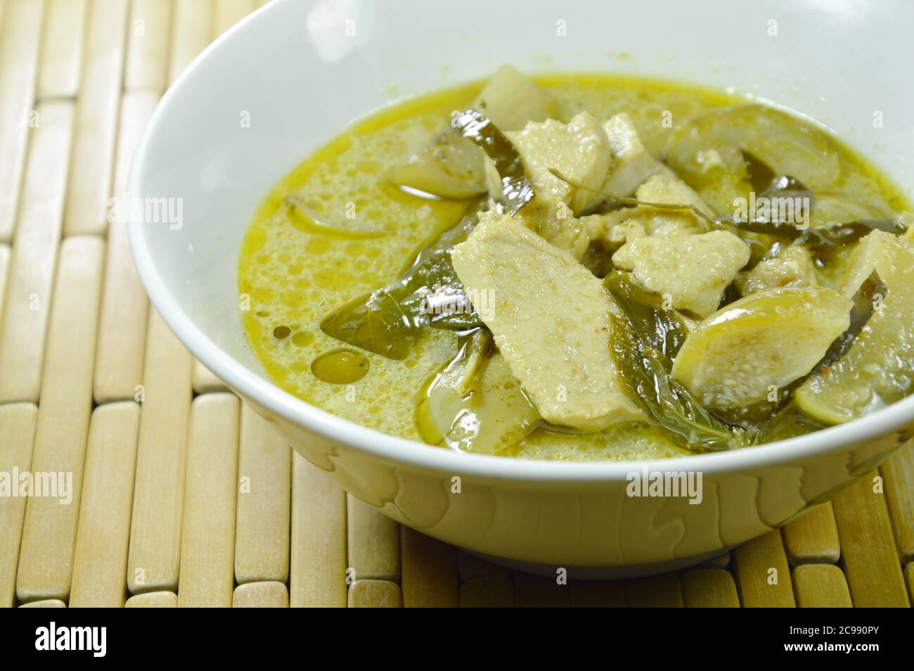 spicy boiled chicken with eggplant in coconut milk green curry on bowl ...