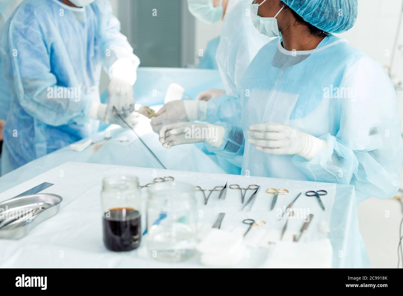 surgical tools lying on the table. close up cropped photo.nurse picks ...