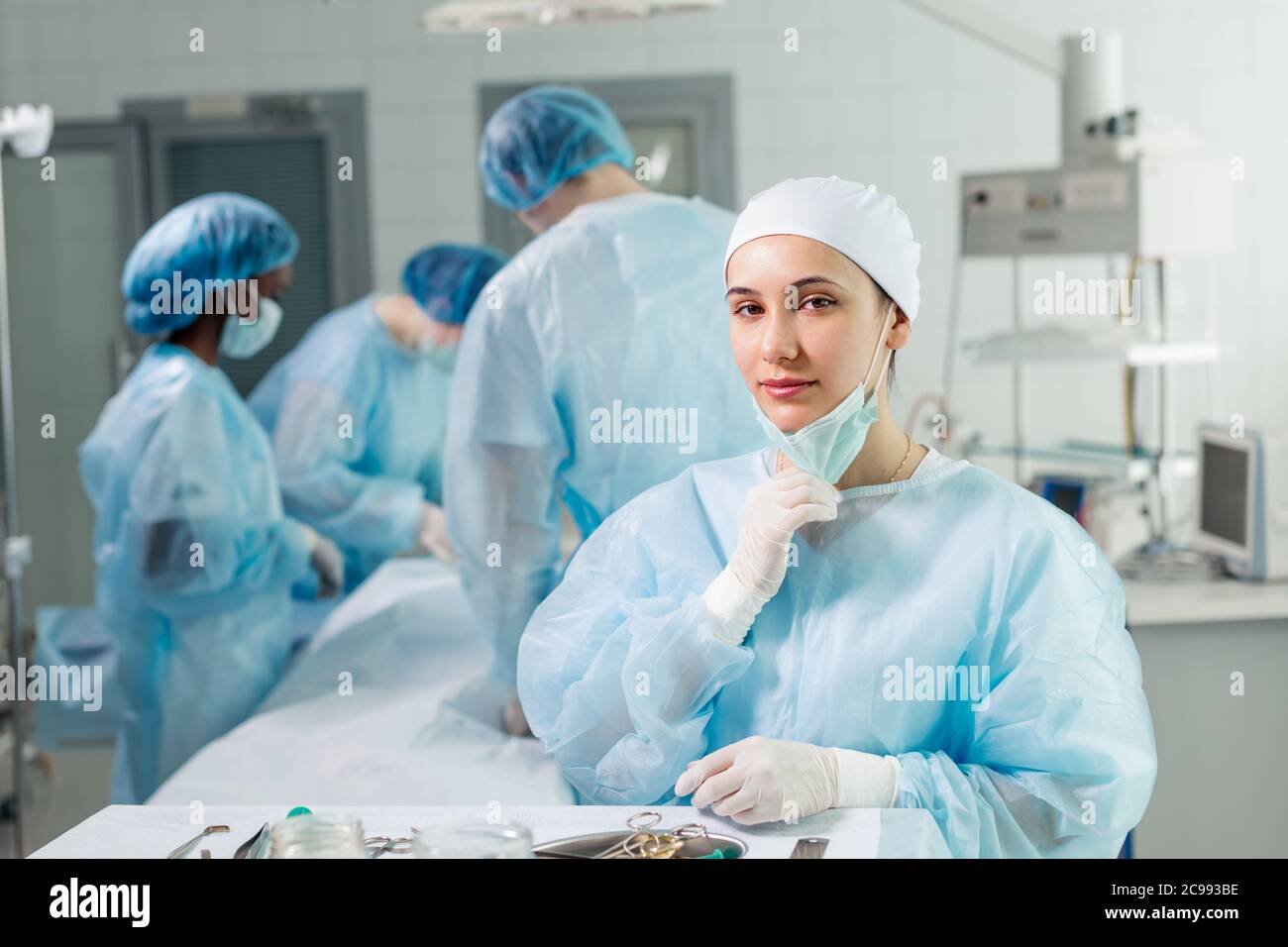 beautiful female surgeon having a rest after operation at workplace ...