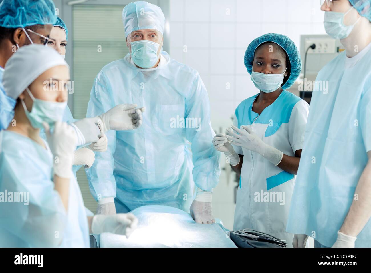 awesome doctors has finished to perform operation in the clinic. close ...