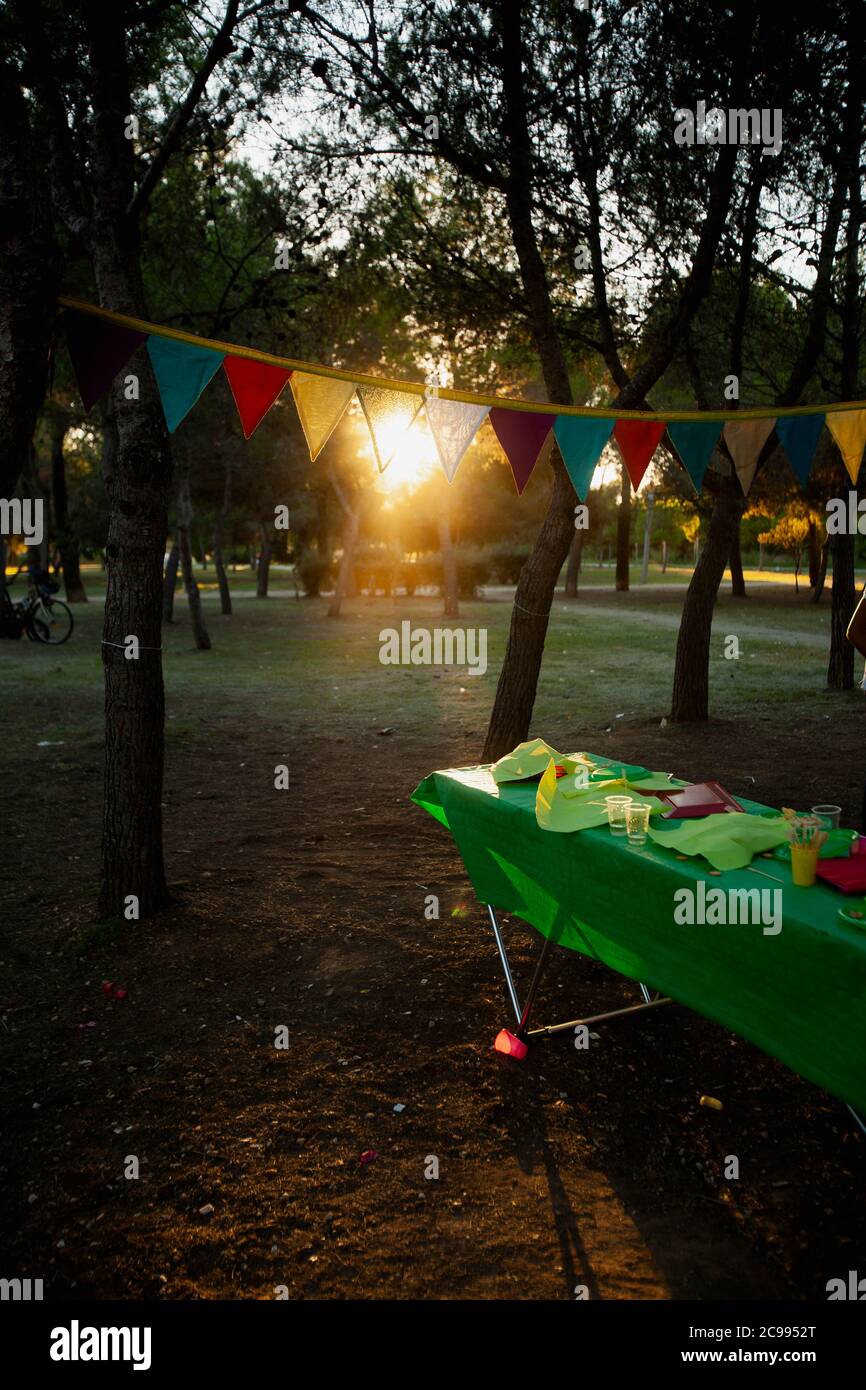 Coloured flags in a birthday party at the park Stock Photo - Alamy