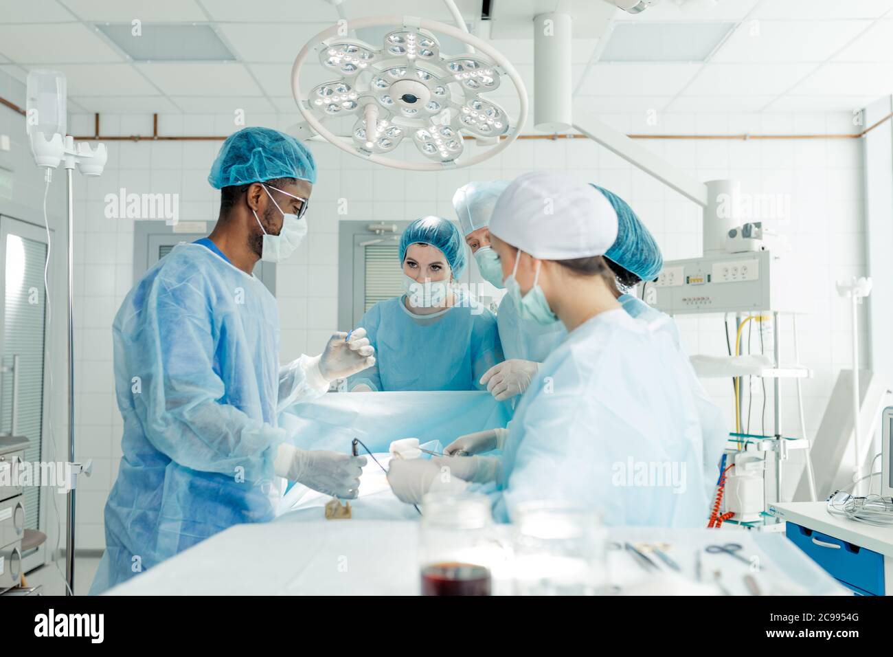 mixed race medical doctors training in human medicine. effective and ...