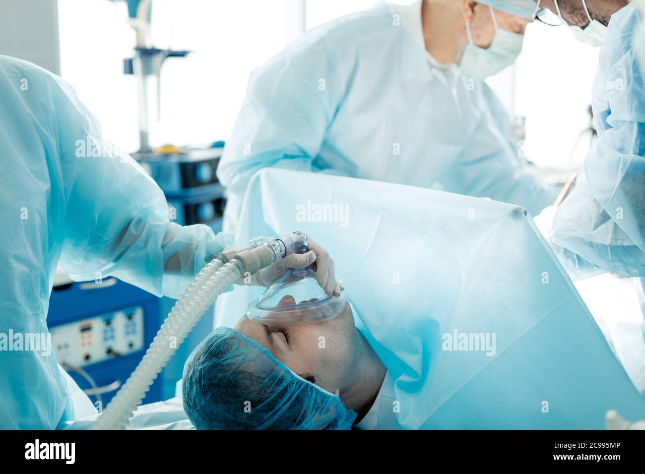 sick man cannot breathe without mask. doctors have been called when man ...