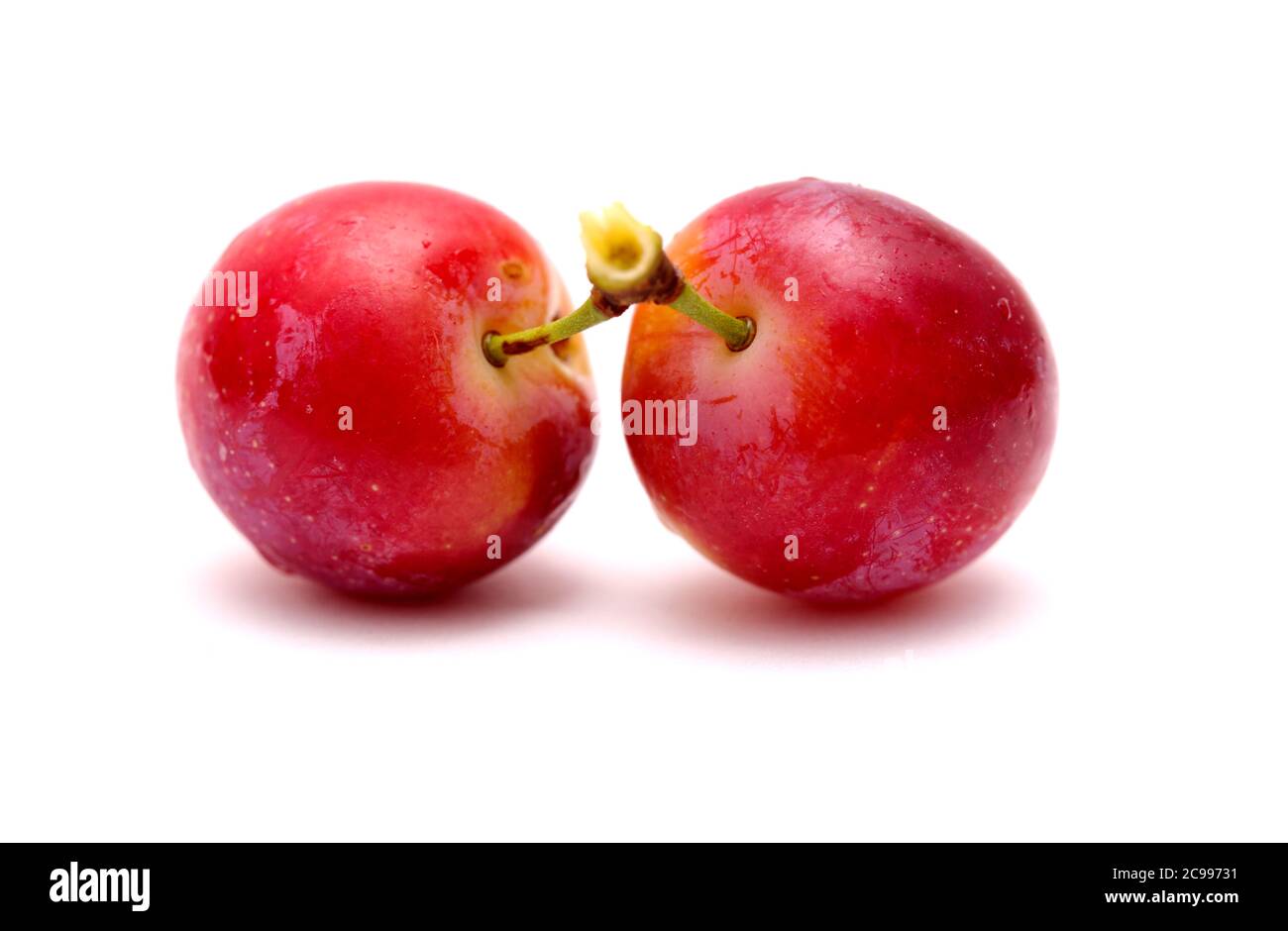 Small cherry plums, isolated on white background Stock Photo - Alamy