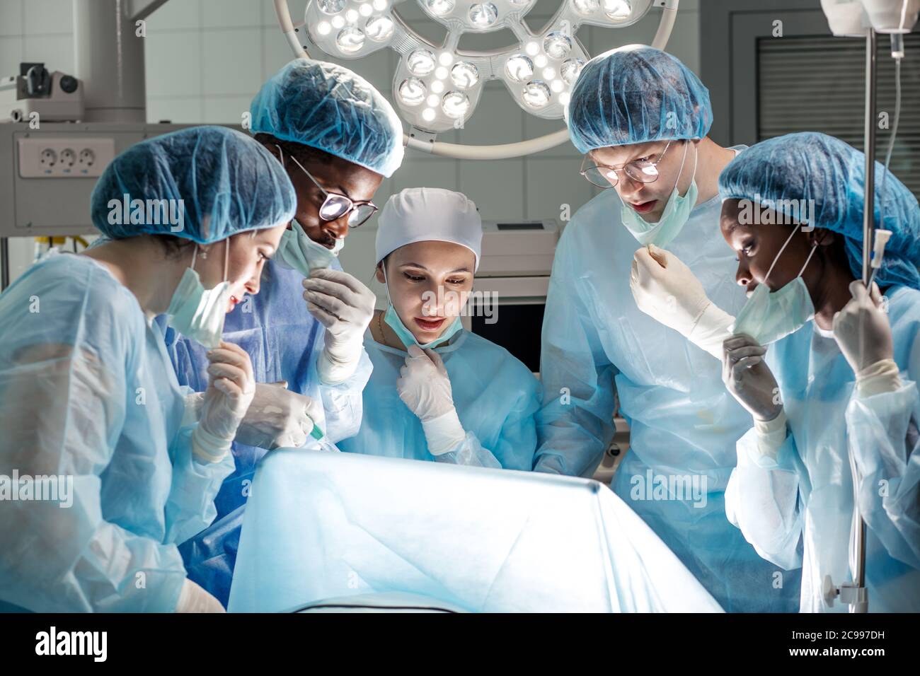 diverse doctors with scared surprised, scared expression staring at the ...