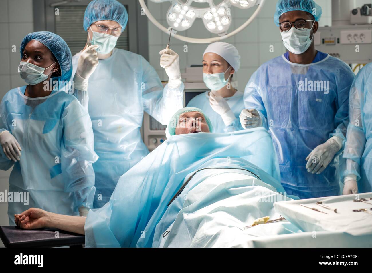 scared emotional patient waking up during the operation, client gets up ...