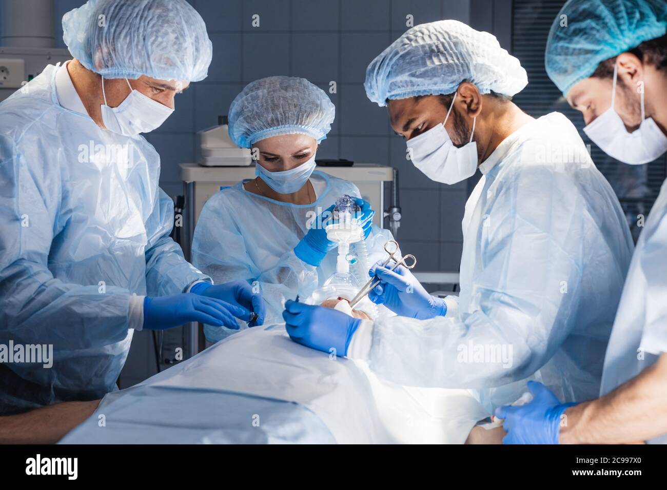 Pre oxygenation for general anesthesia. Focused surgeon team operating ...