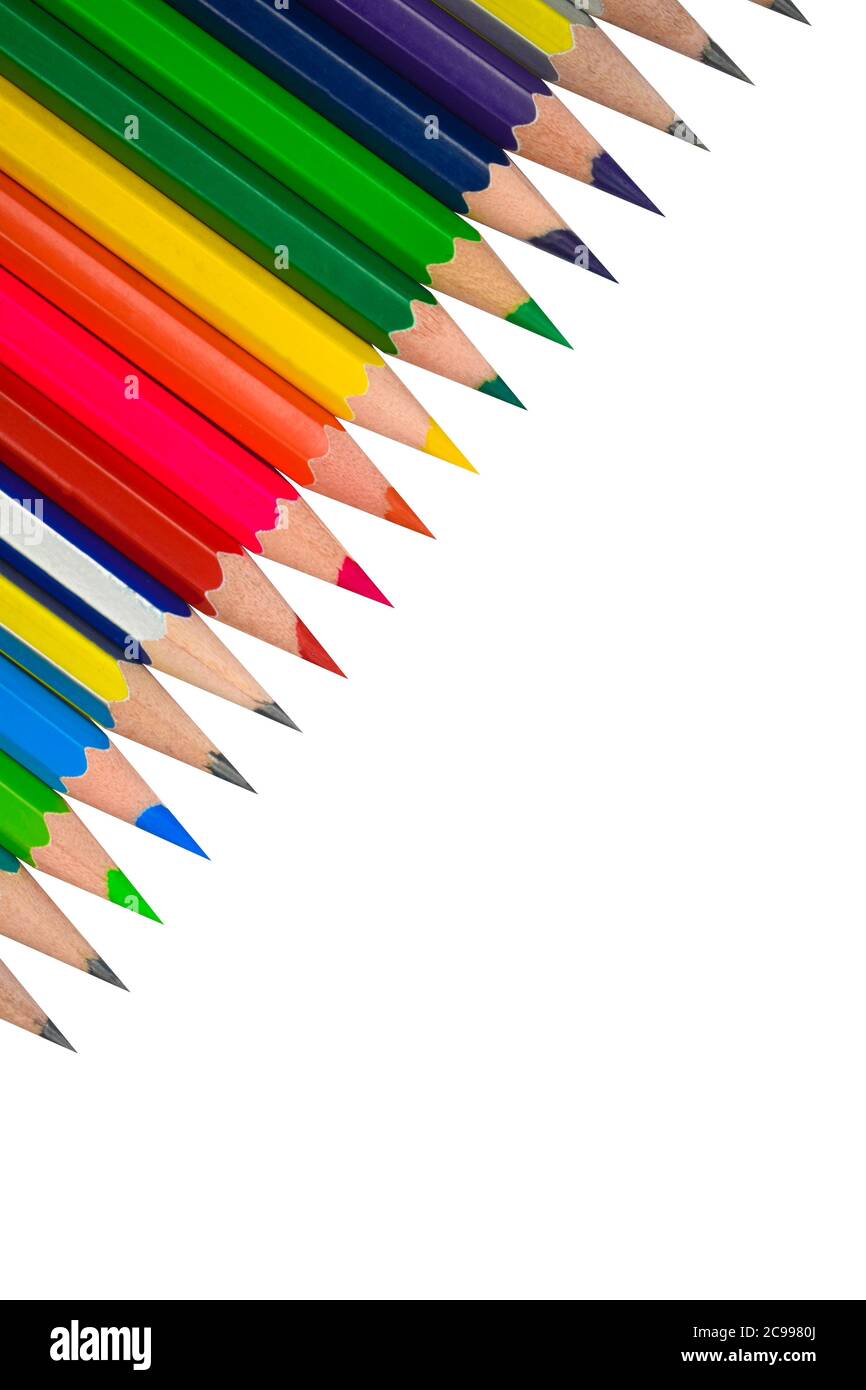 A angle line of different colored wood pencil crayons placed on a white ...
