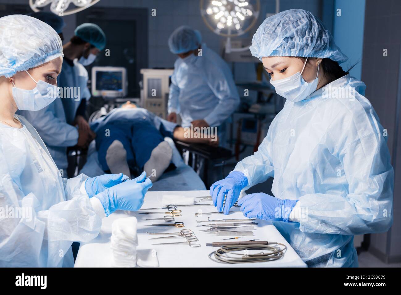 modern hospital operating room with steel sterile medical instruments ...