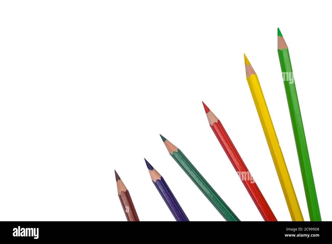 Six various colored wood pencil crayons placed on a white isolated ...