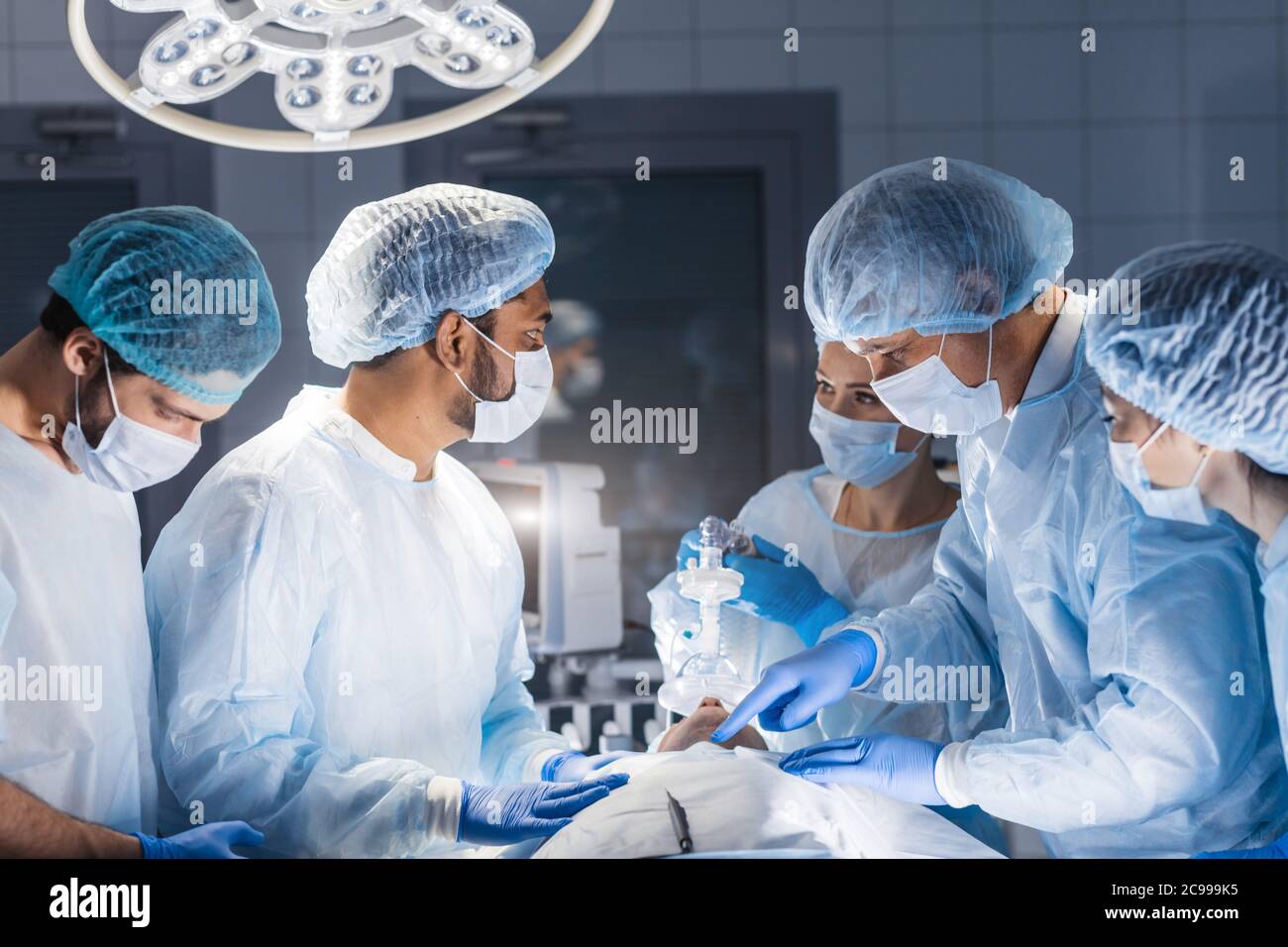 Pre oxygenation for general anesthesia. Focused surgeon team operating ...