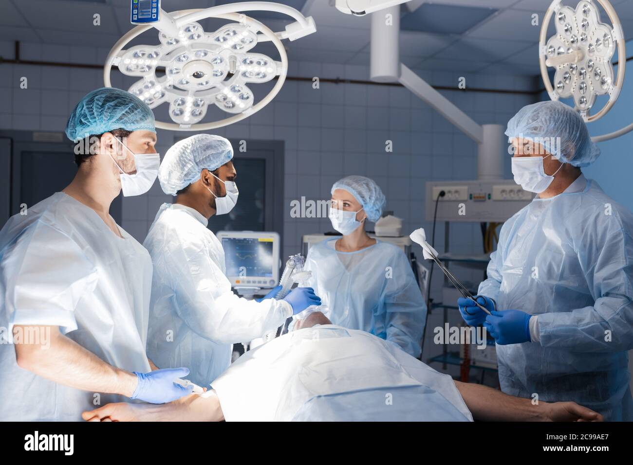 Stitching after a complex and bloody surgery. Modern medical equipment ...