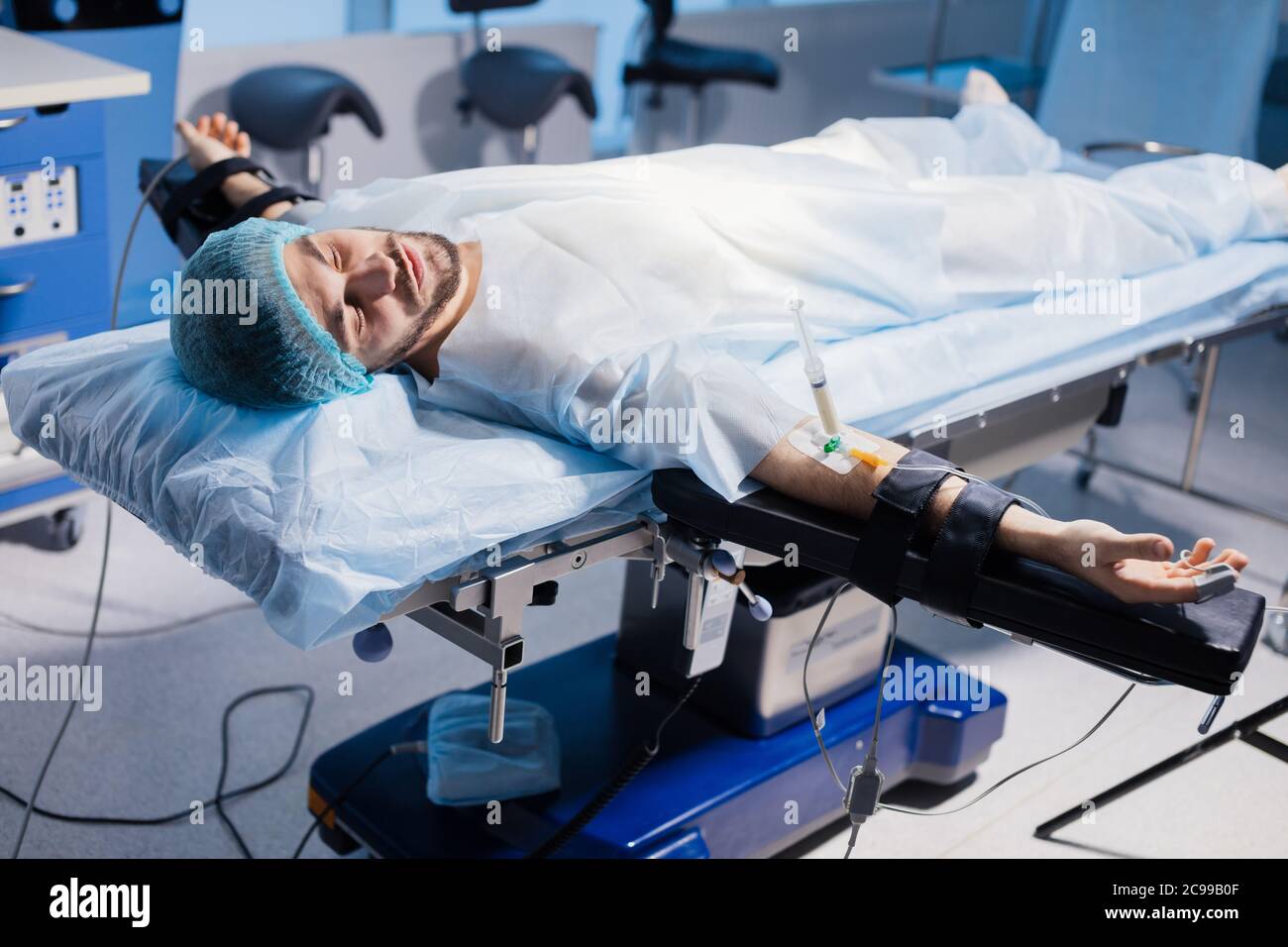 Male Patient prepared by a team of anesthetists for abdominal surgery ...