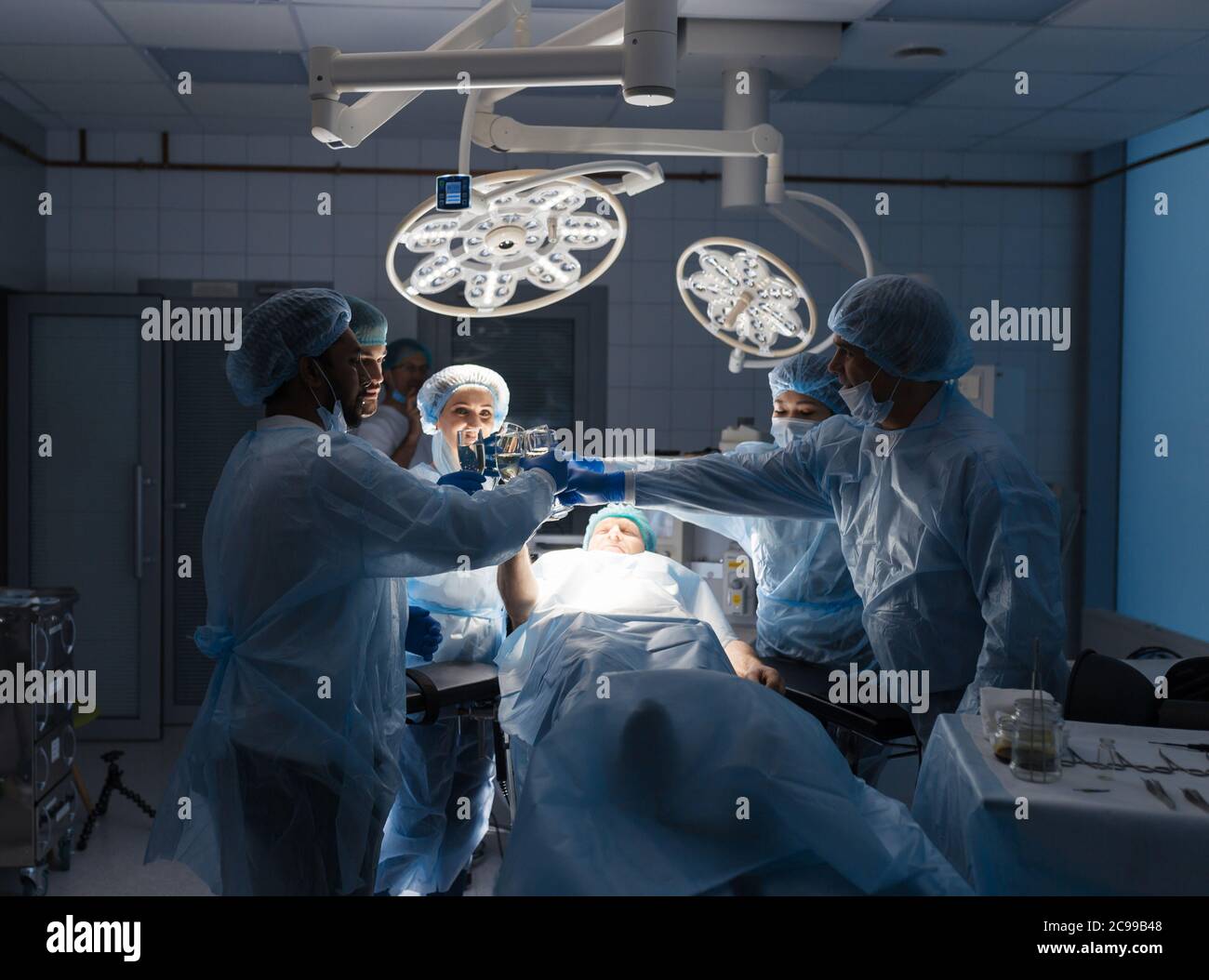 team of surgeons congratulating each other with New Year, cheering with ...