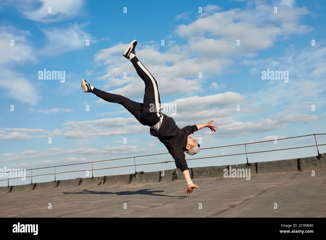 Young Korean urban style male dancer working out, performing breakdance ...