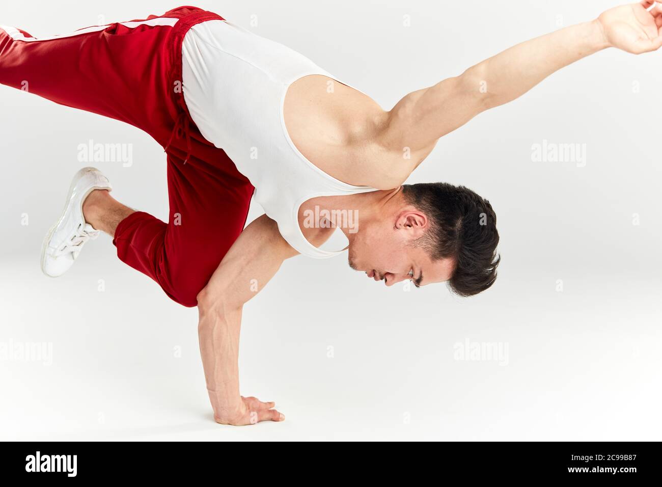 Hip hop male Korean break dancer dancing on white background ...