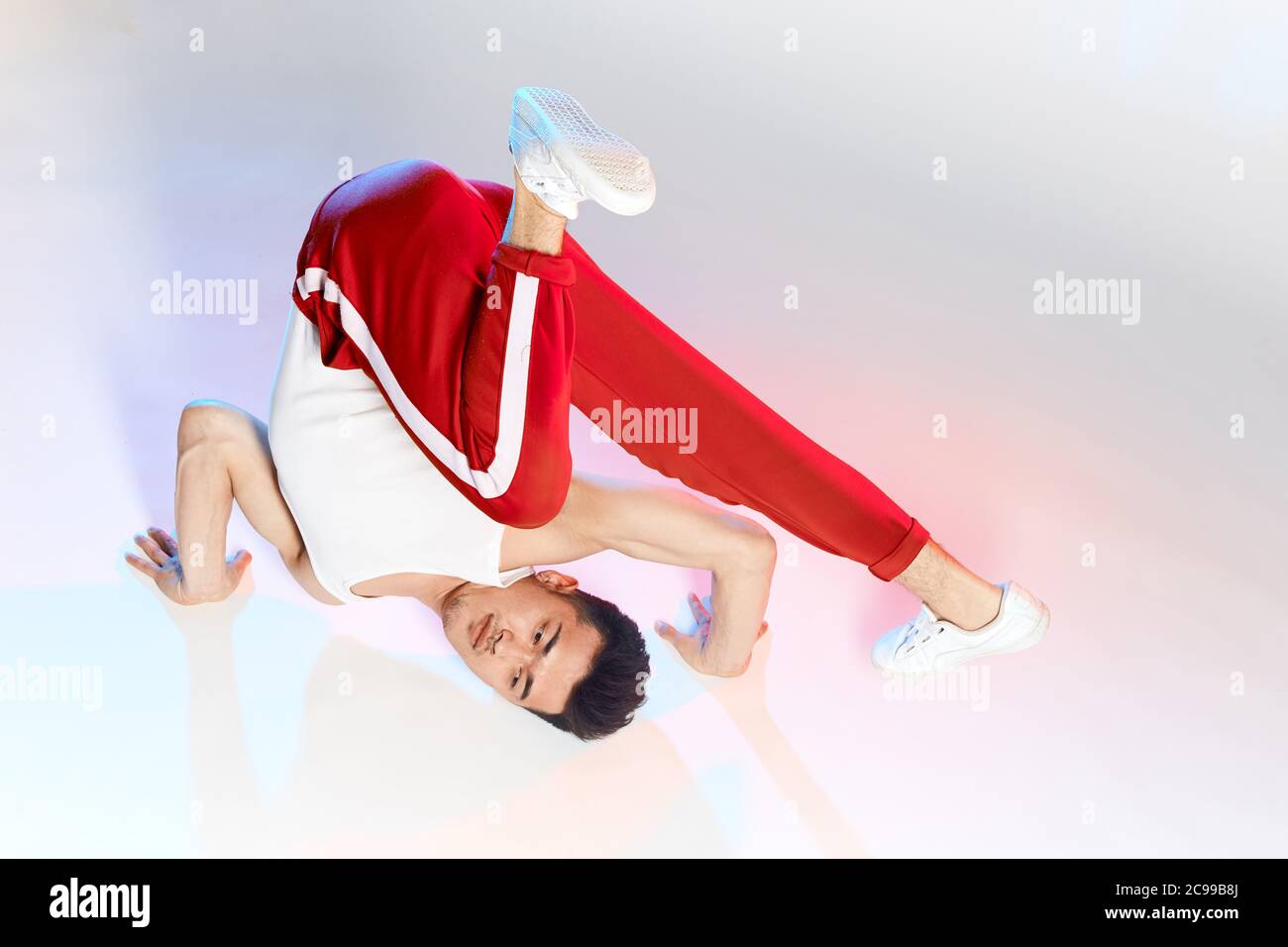 Hip hop male Korean break dancer dancing on white background ...
