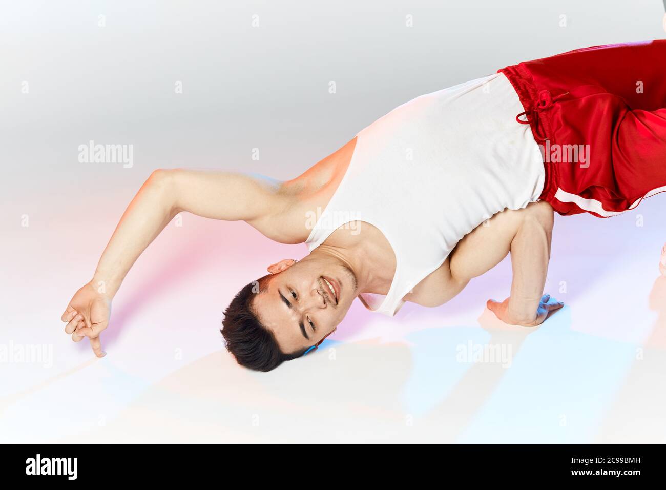 Isolated Korean breakdancer training on white background, performing ...